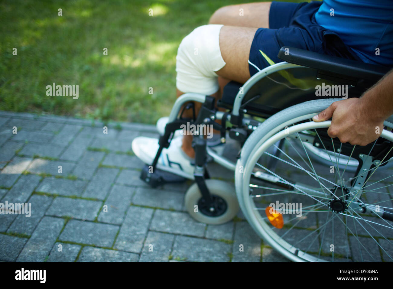 Man in wheelchair walker hi-res stock photography and images - Alamy