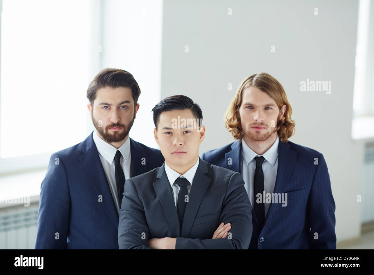 Serious looking businessmen hi-res stock photography and images - Alamy
