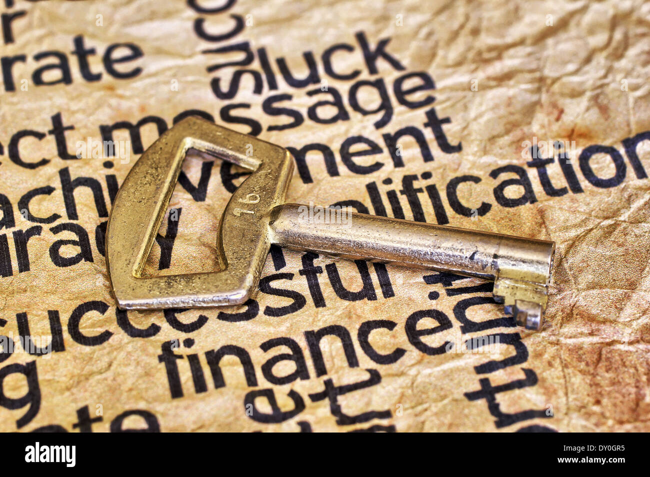 Finance text and golden key Stock Photo - Alamy