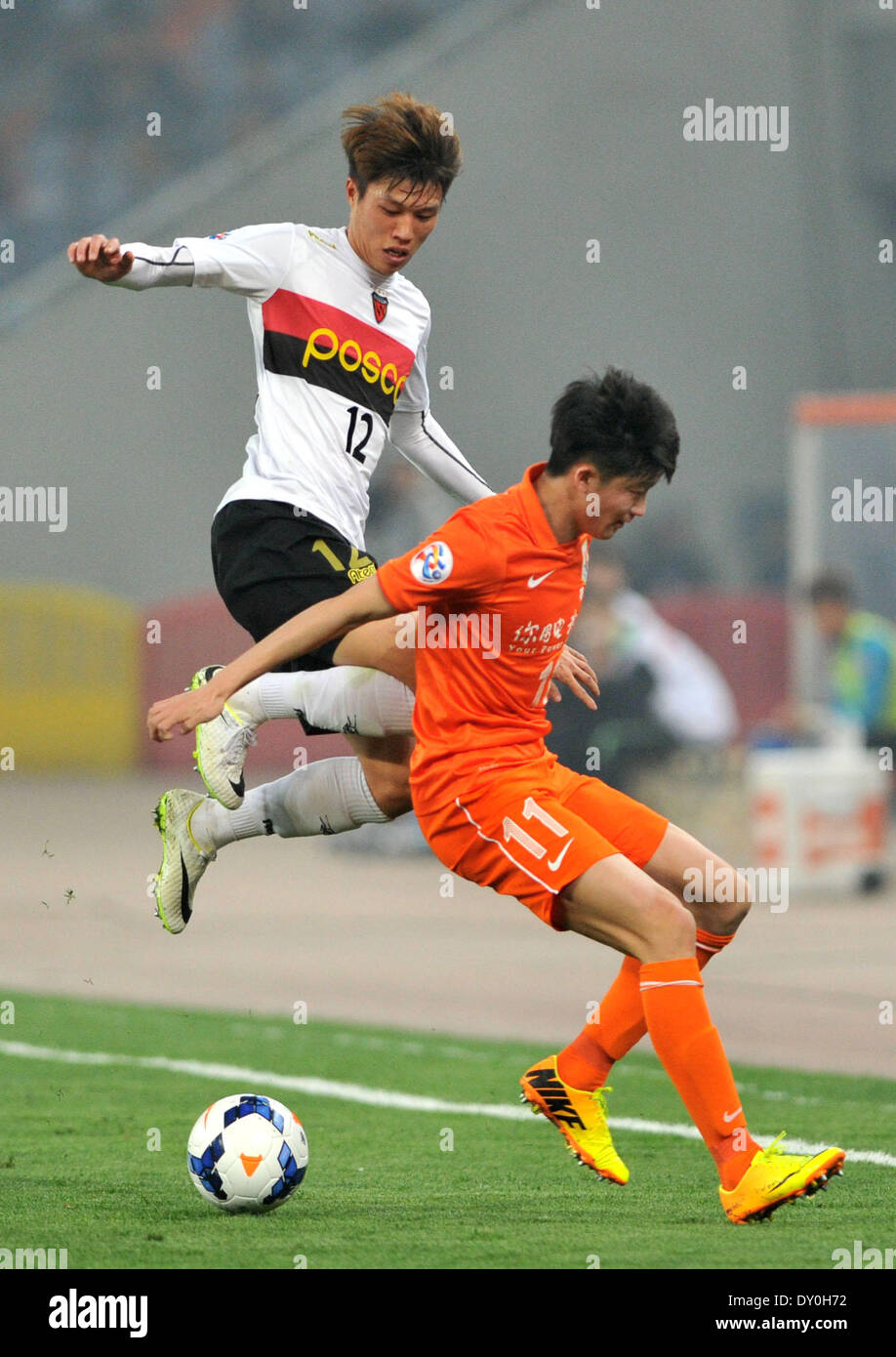 Jinan, China's Shandong Province. 2nd Apr, 2014. Kim Seung Dae (L) of ...