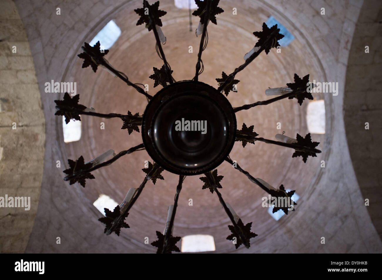 A chandelier hangs from the ceiling in the church of the Greek Orthodox ...