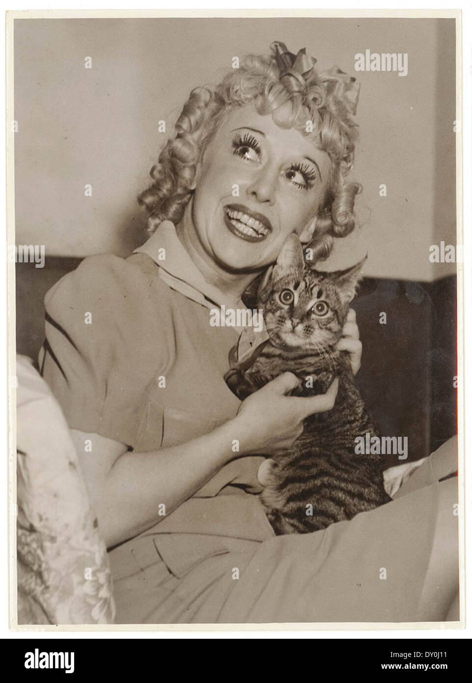 Comedian Violet Carlson is captured in her dressing room with a cat in ...