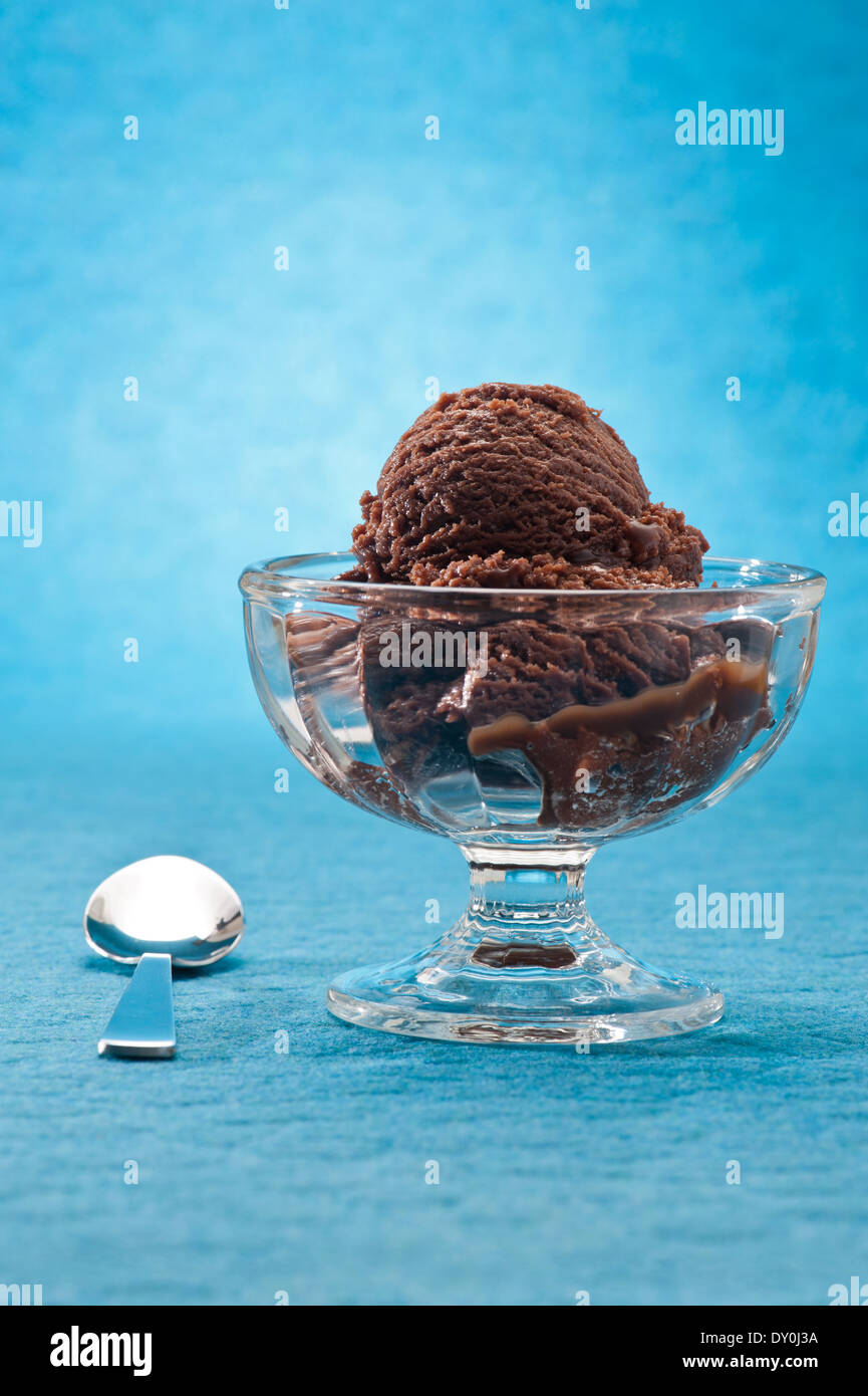 chocolate ice cream over a blue background Stock Photo - Alamy