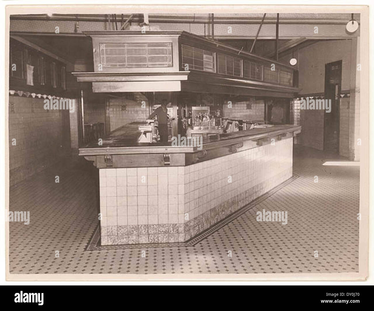 A 1930s photograph by Sam Hood of a public bar. The image captures the ...