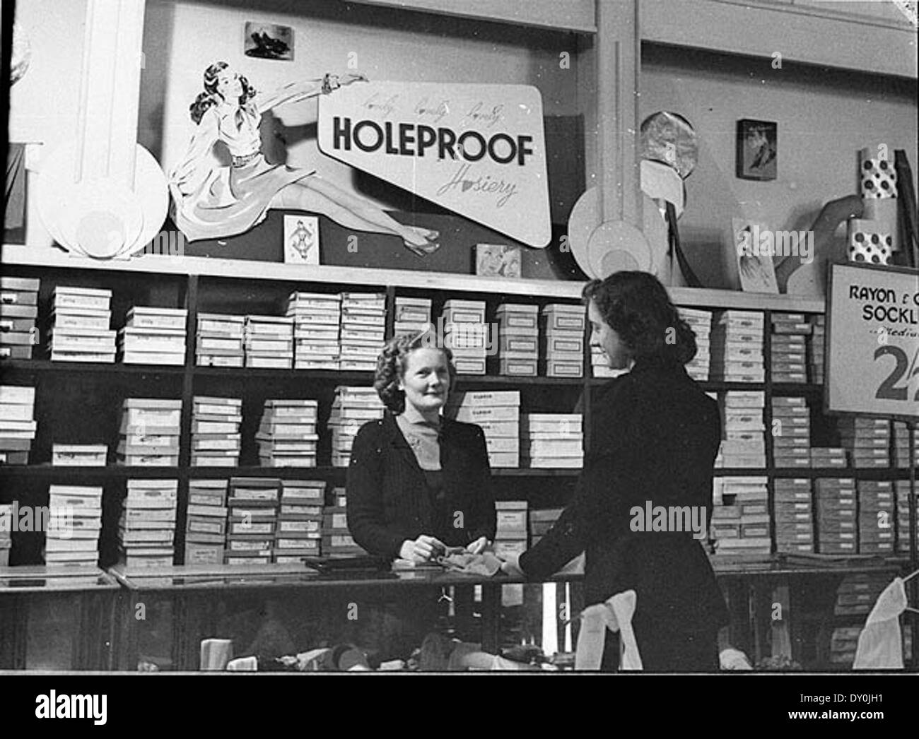 A 1948 photograph by Sam Hood showing a Holeproof hosiery display ...