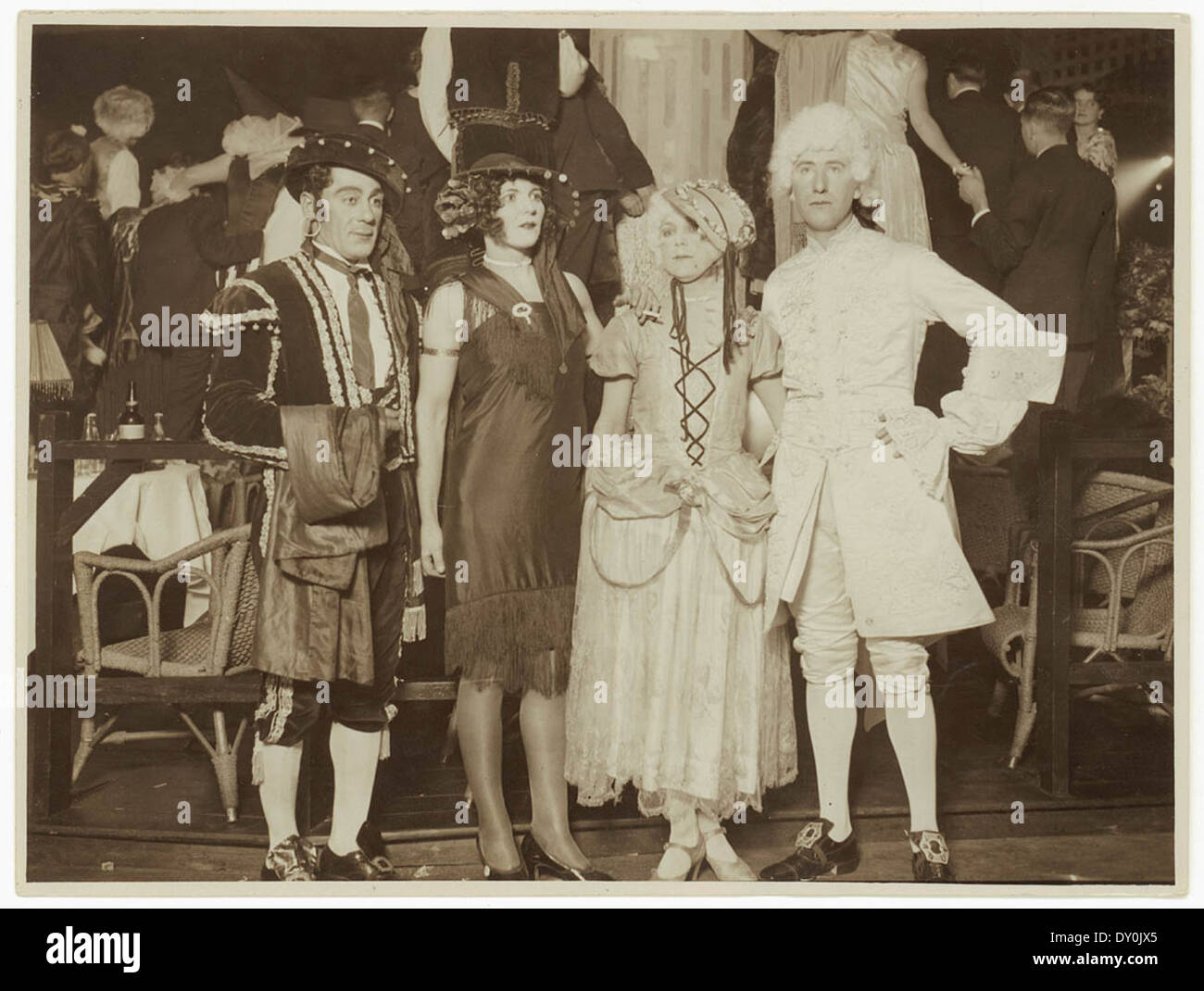 This photograph by Sam Hood from the 1920s shows a fancy dress ball ...