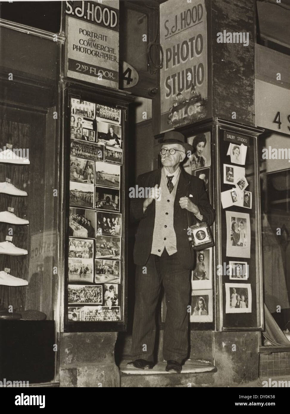 This photograph from 1953 captures Sam Hood standing outside his Dalny ...
