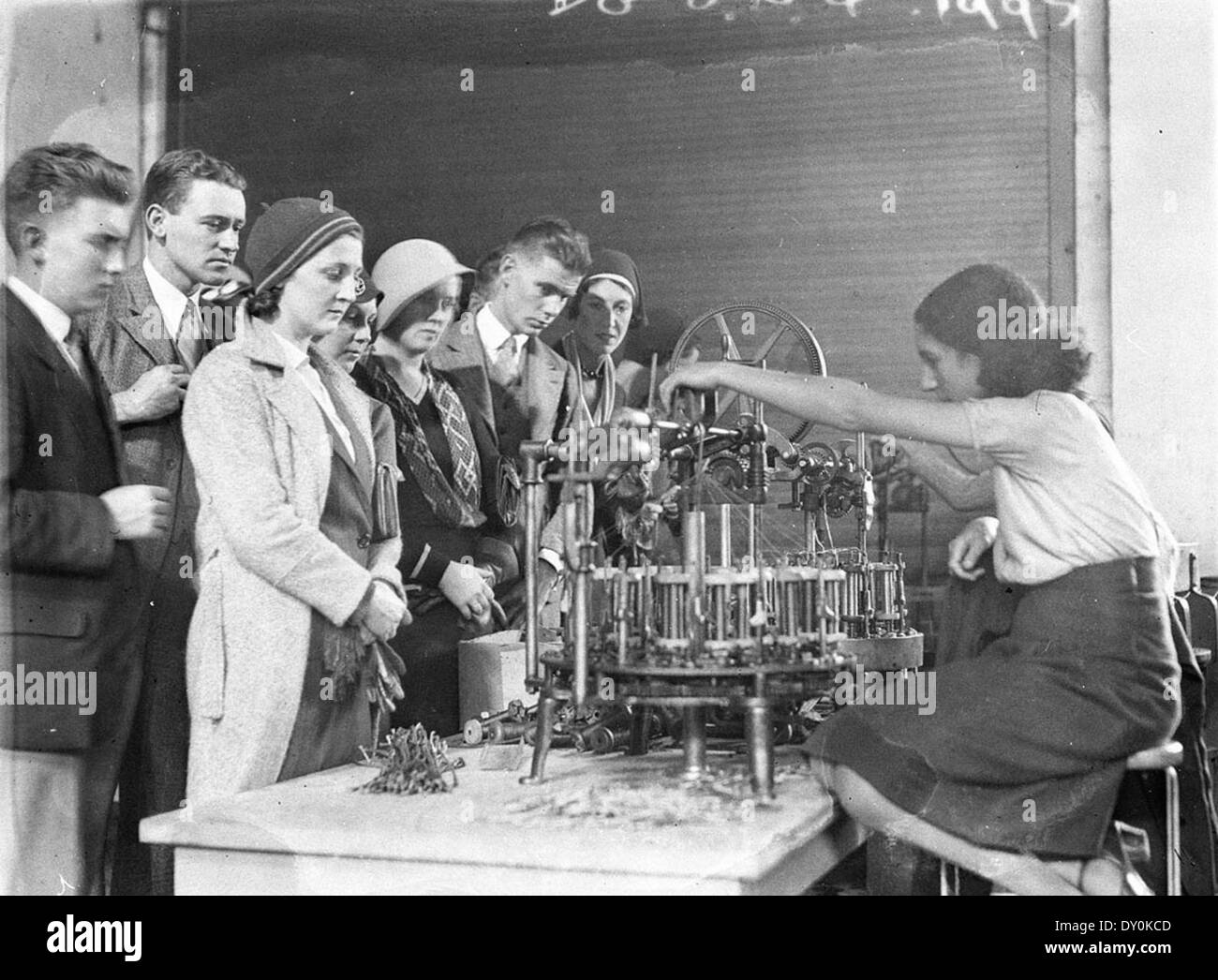 This image, taken by Sam Hood around 1931, shows a girl operating a ...