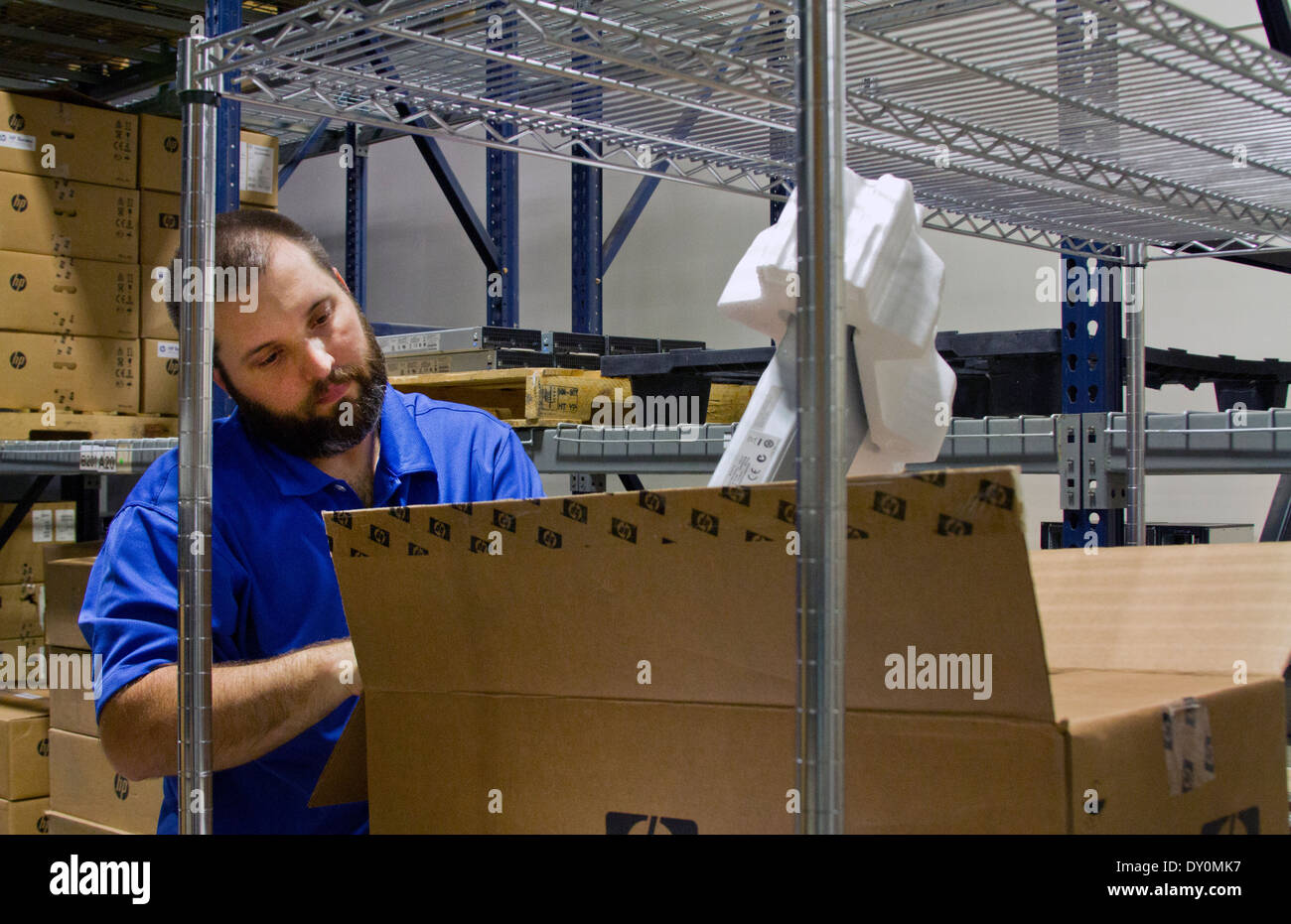 employee stacking boxes in HP computer technology warehouse Stock Photo ...