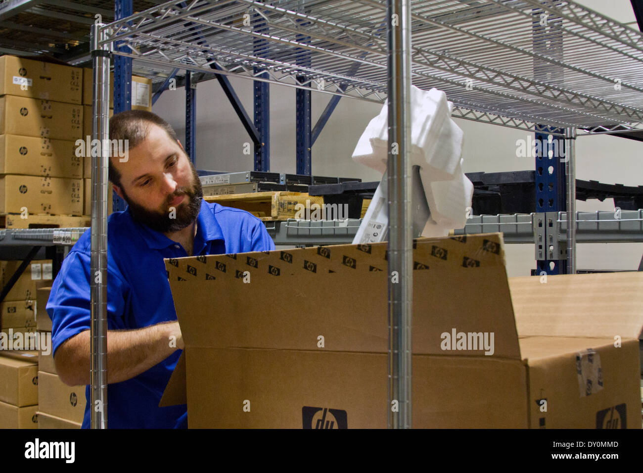 employee stacking boxes in HP computer technology warehouse Stock Photo ...