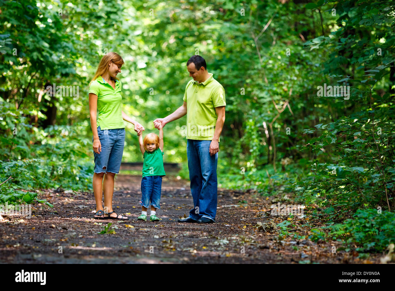 Portrait of Happy Family In Park - outdoor shot Stock Photo - Alamy
