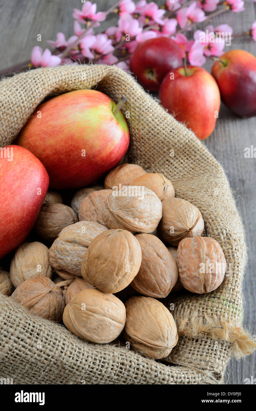 sack of nut and red delicious apples with flowers Stock Photo - Alamy