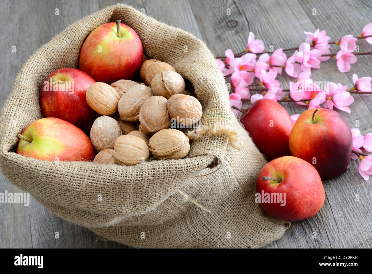 sack of nut and red delicious apples with flowers Stock Photo - Alamy