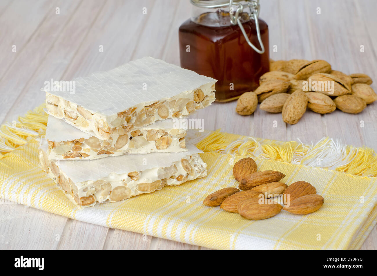 Pieces of Christmas hard almond turron on white background. This ...