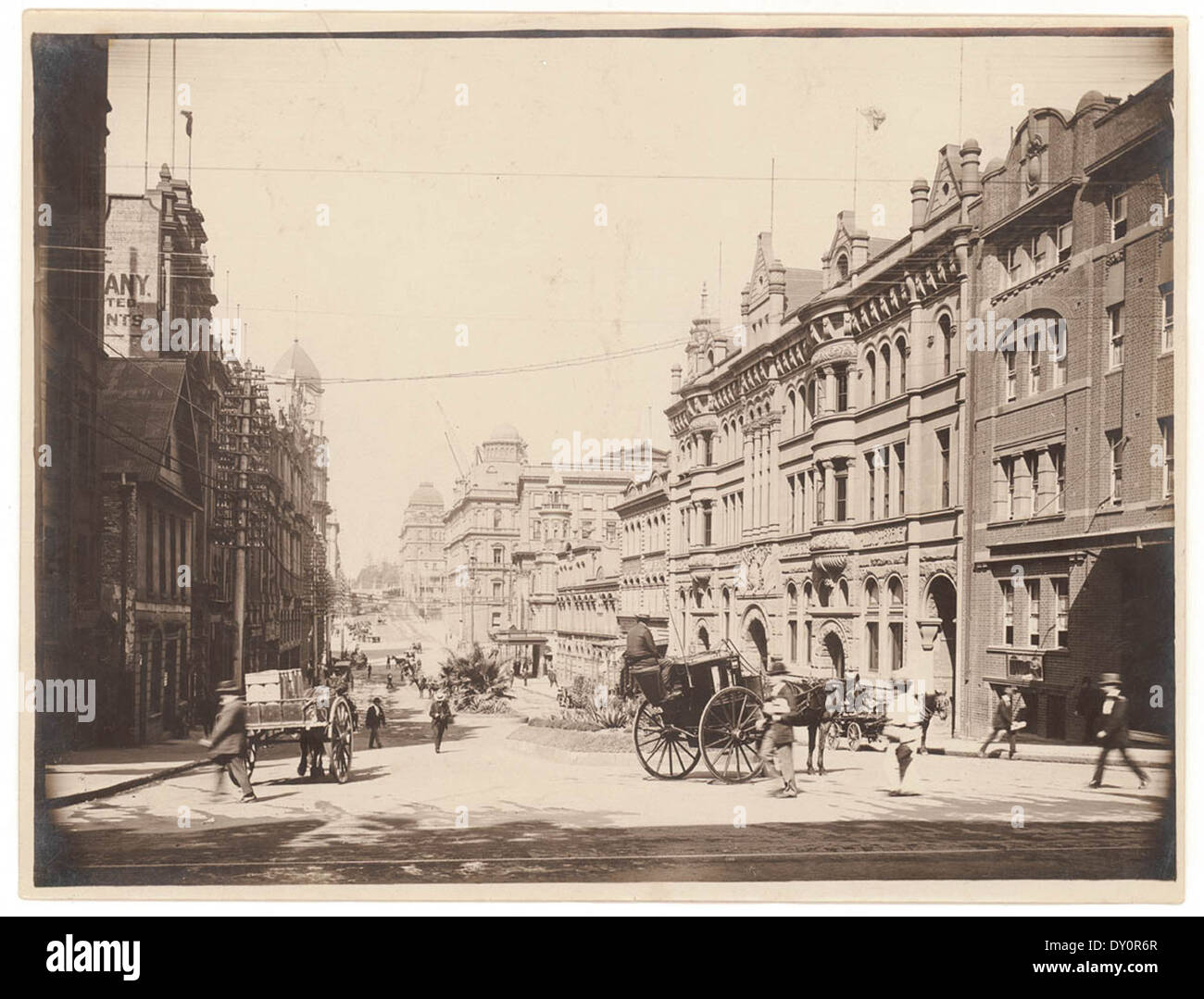 This historical image shows a view of Bridge Street in Sydney, looking ...