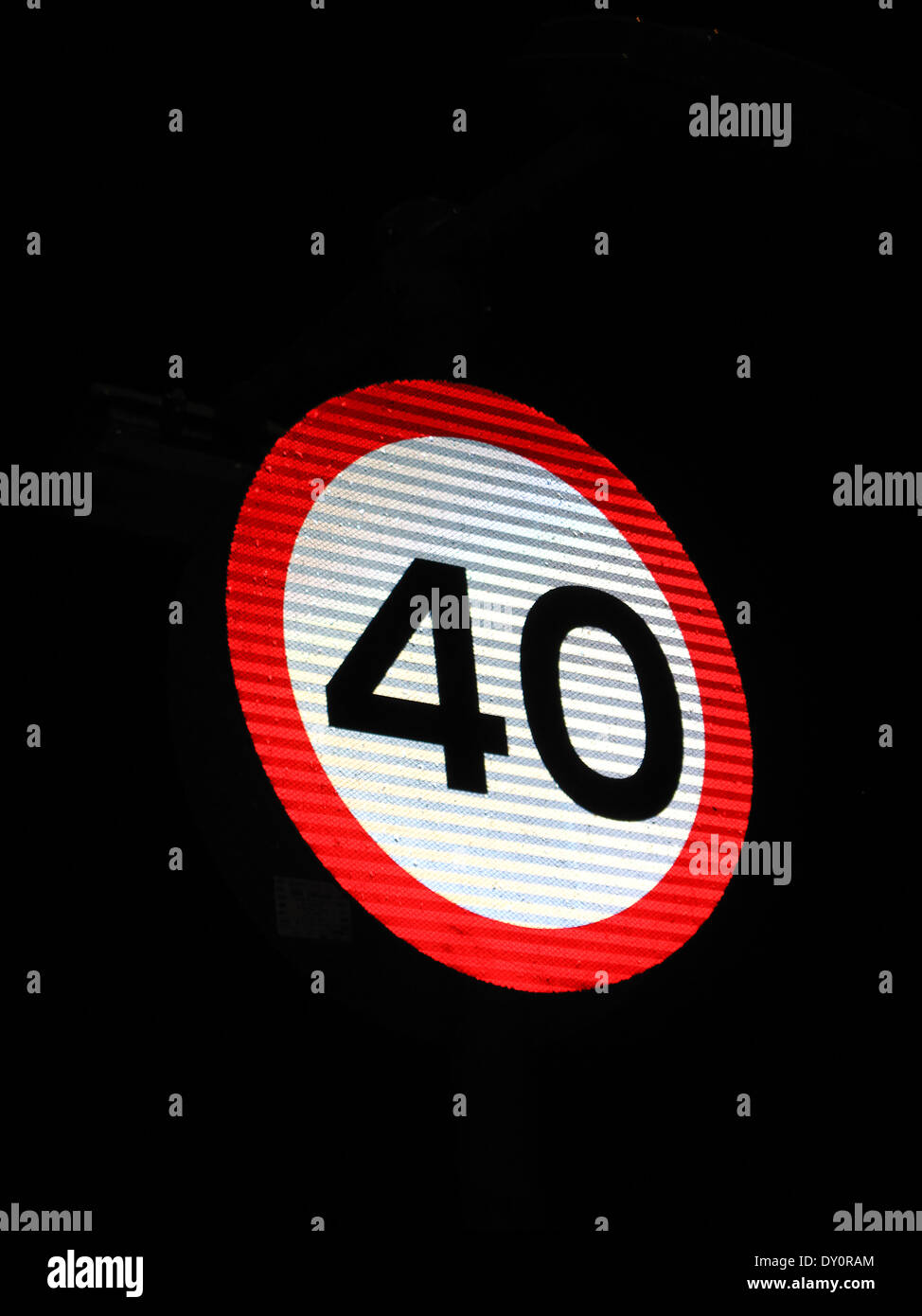 UK 40mph road traffic sign in dark Stock Photo - Alamy