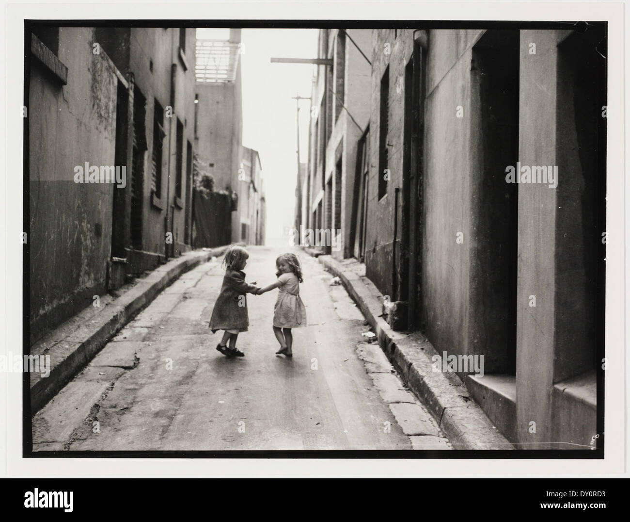 A photograph from 1949 by Ted Hood depicting children in the slums of ...