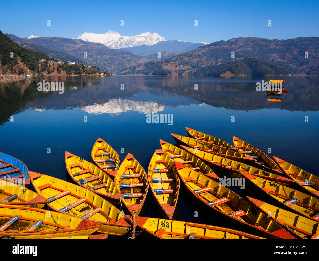 Boats and reflections in Begnas Tal, Nepal Stock Photo - Alamy