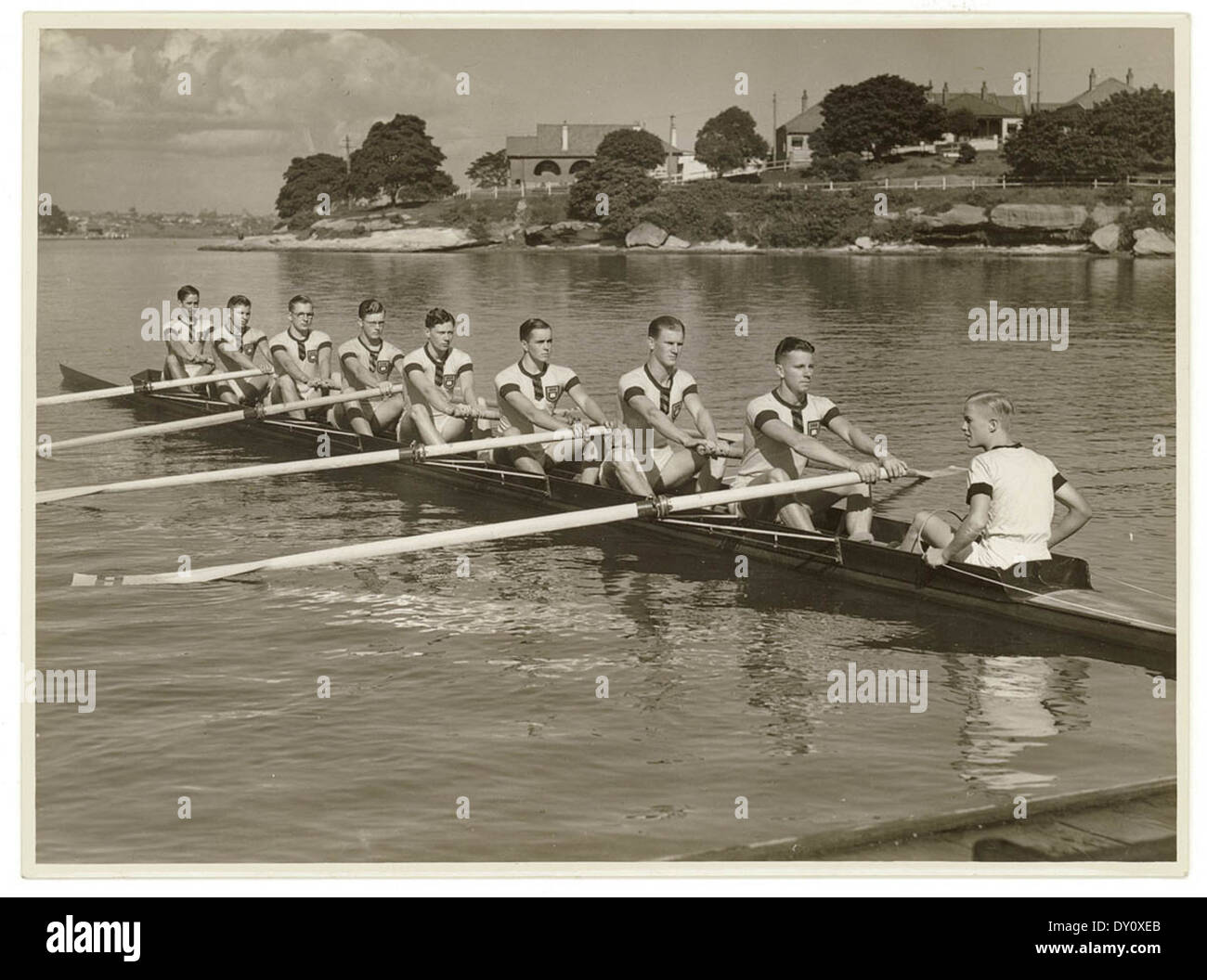 This historical photograph, taken by Sam Hood, shows the rowing team of ...