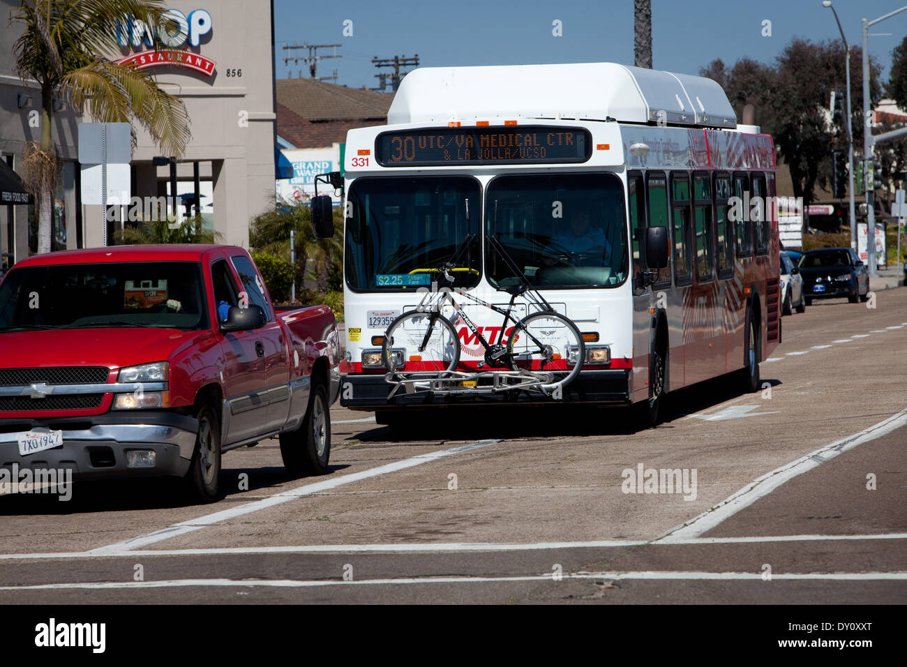 A bicycle mounted on a bike rack on a MTS Bus on Mission blvd, in April ...