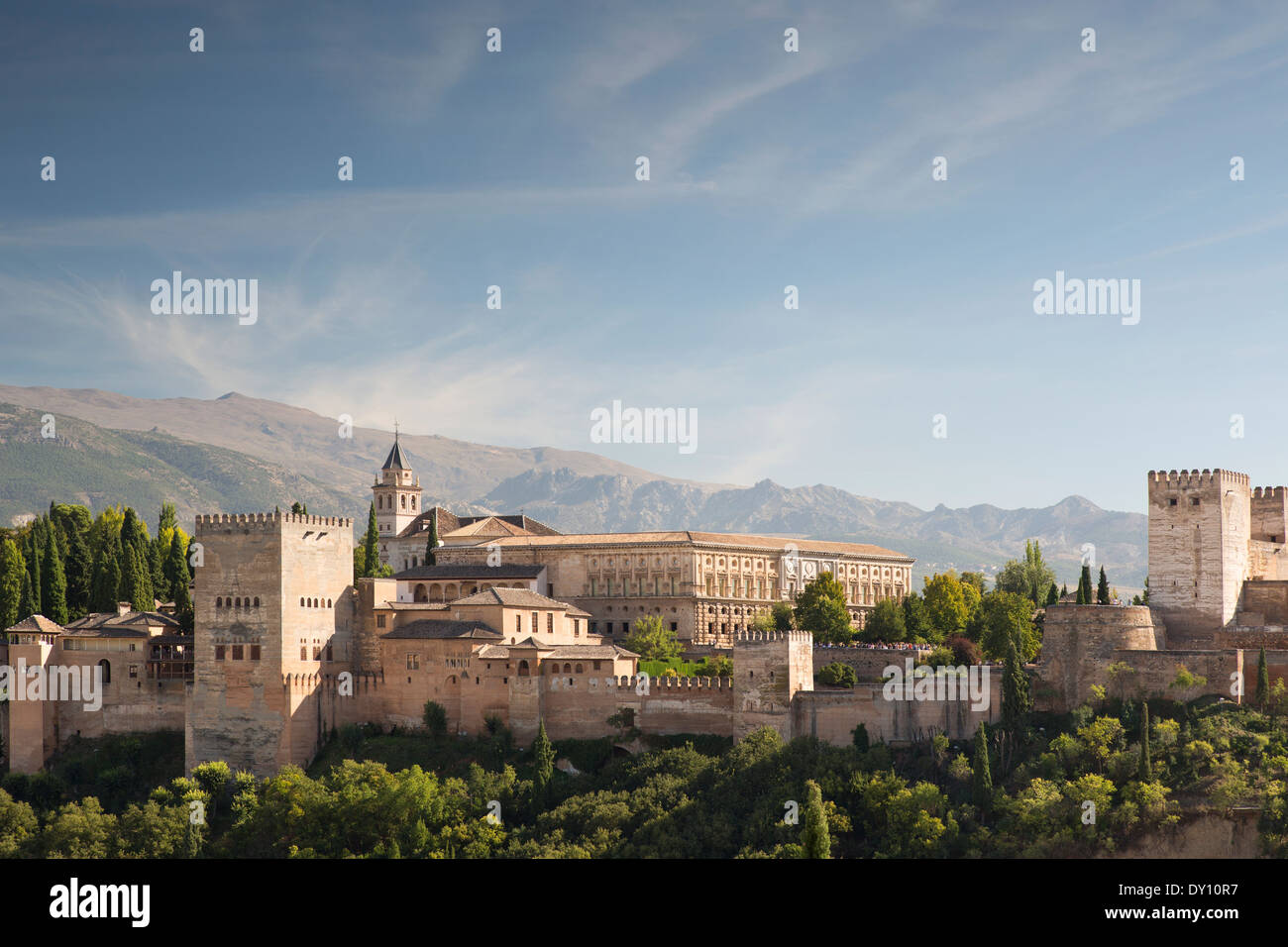 shot of the alhambra palace in granada with the sierra nevada mountains ...