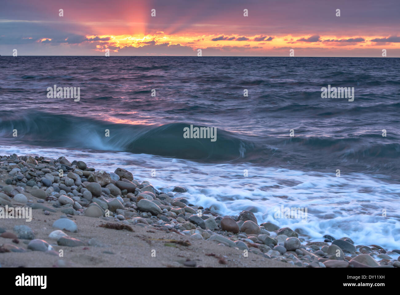 Sea beach on sunset time Stock Photo - Alamy
