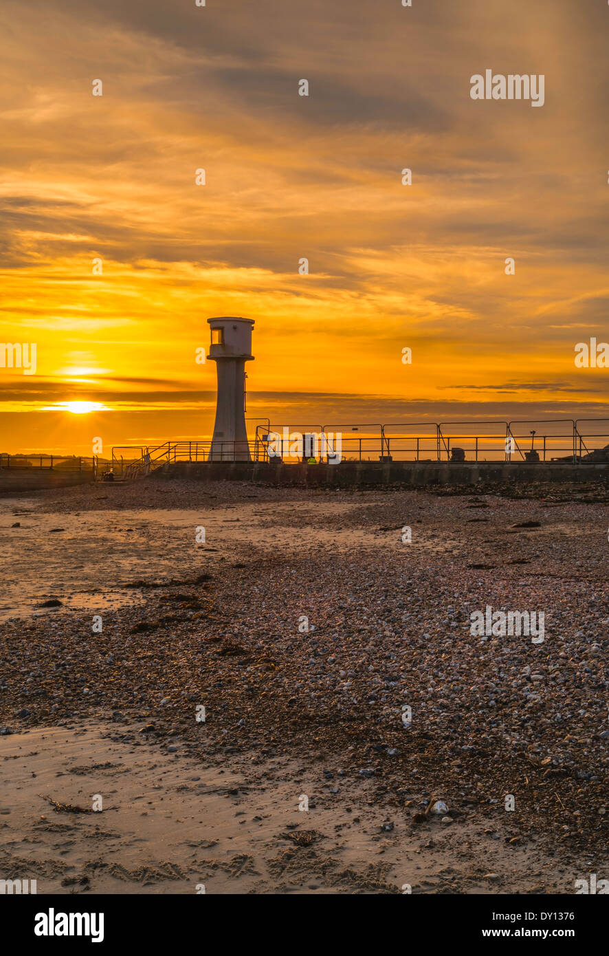 Sunset behind lighthouse at Littlehampton, West Sussex, UK Stock Photo ...