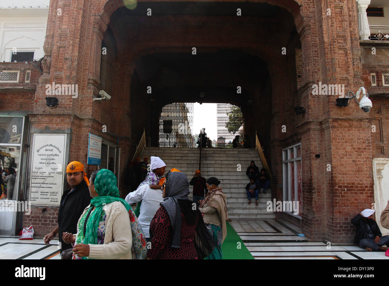 Devotees in front of one of the entry gates of the Golden Temple ...