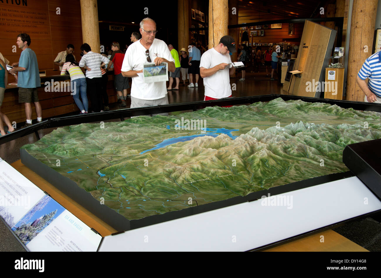 New visitors center, tourist study maps as they look at the large ...