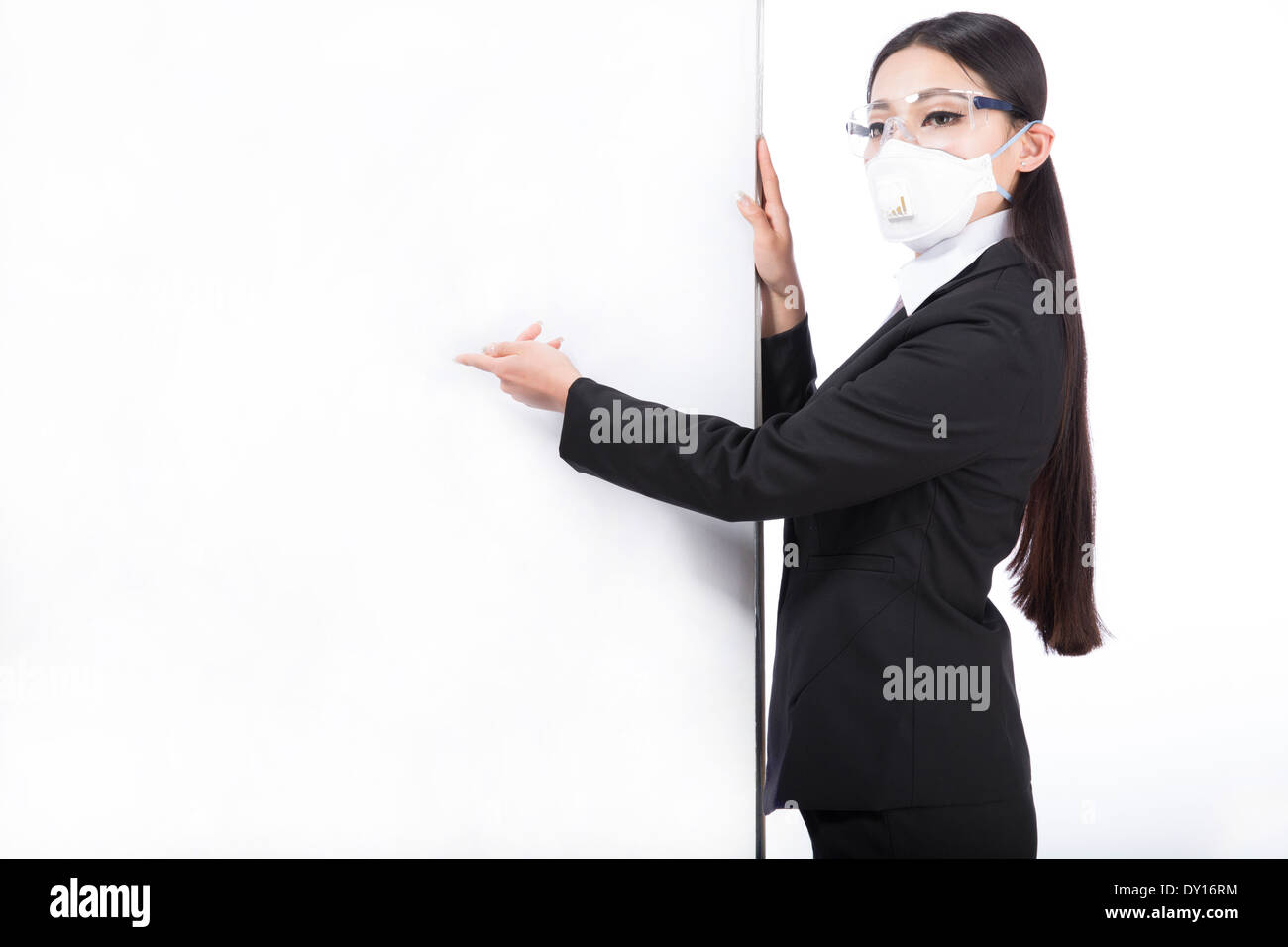 black hair girl with a mask on her face. Isolated on white Stock Photo ...