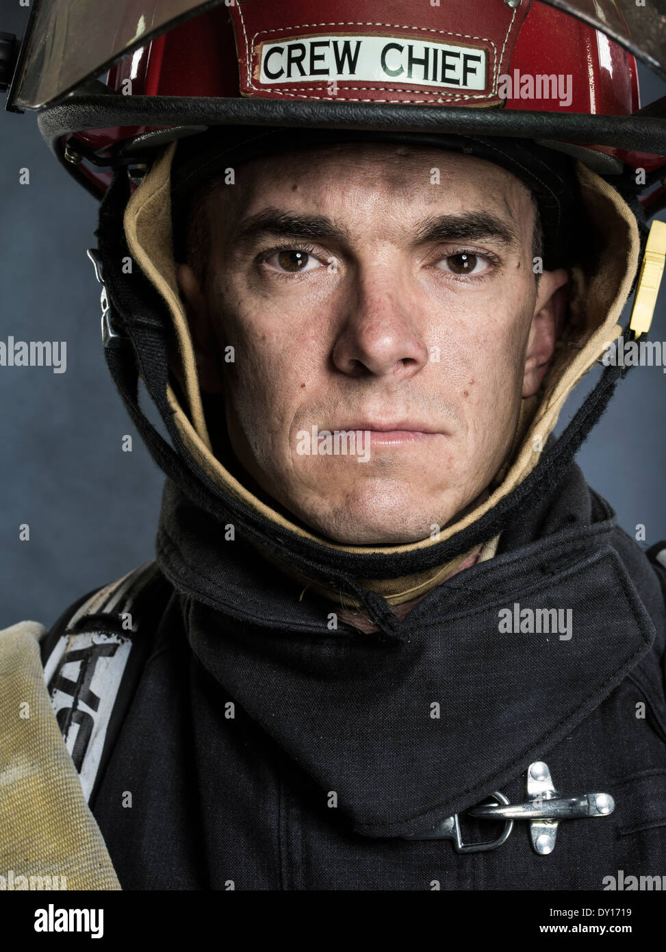 Male firefighter in structural firefighting uniform with breathing ...