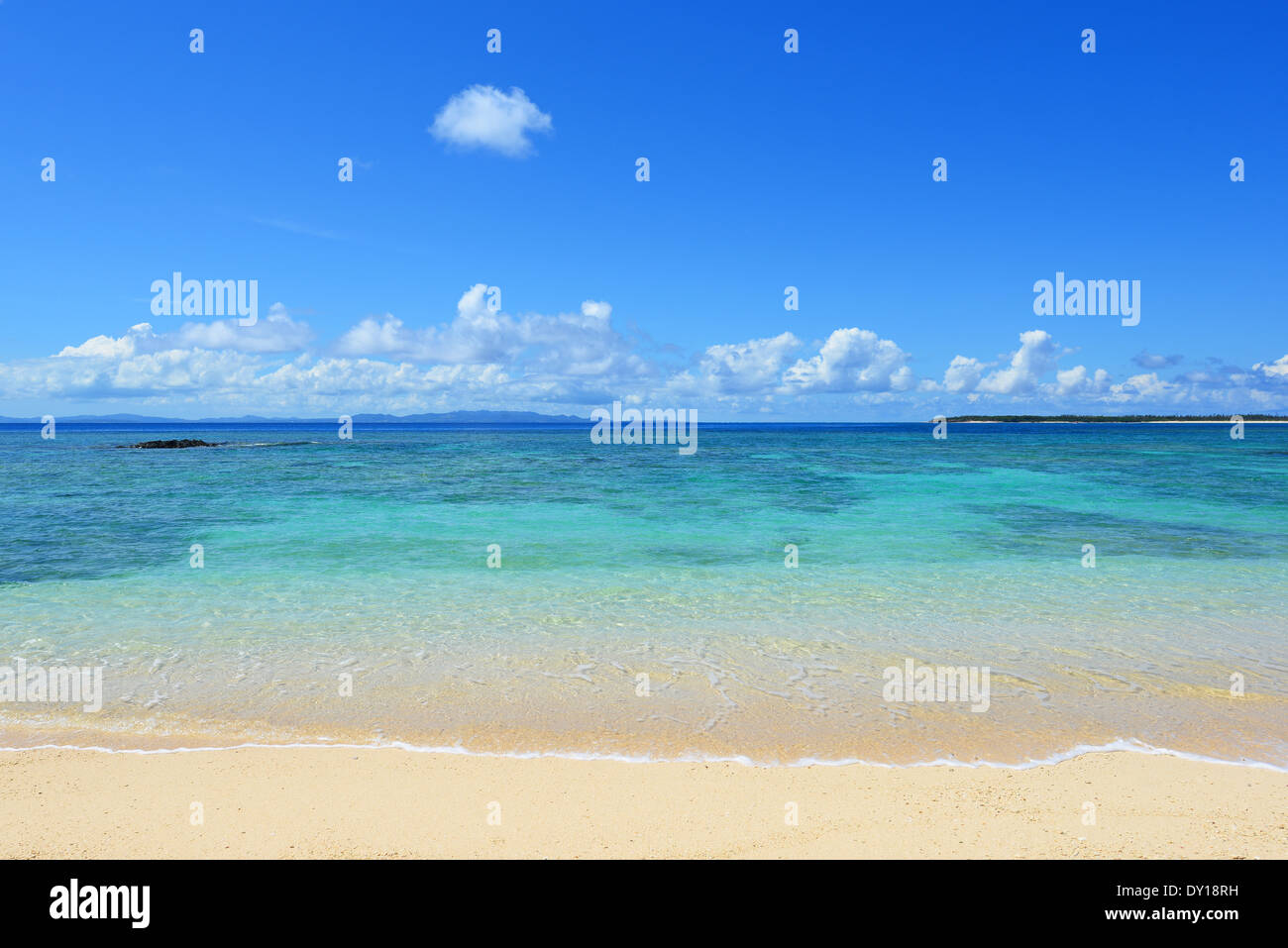 beautiful beach and blue sky Stock Photo - Alamy