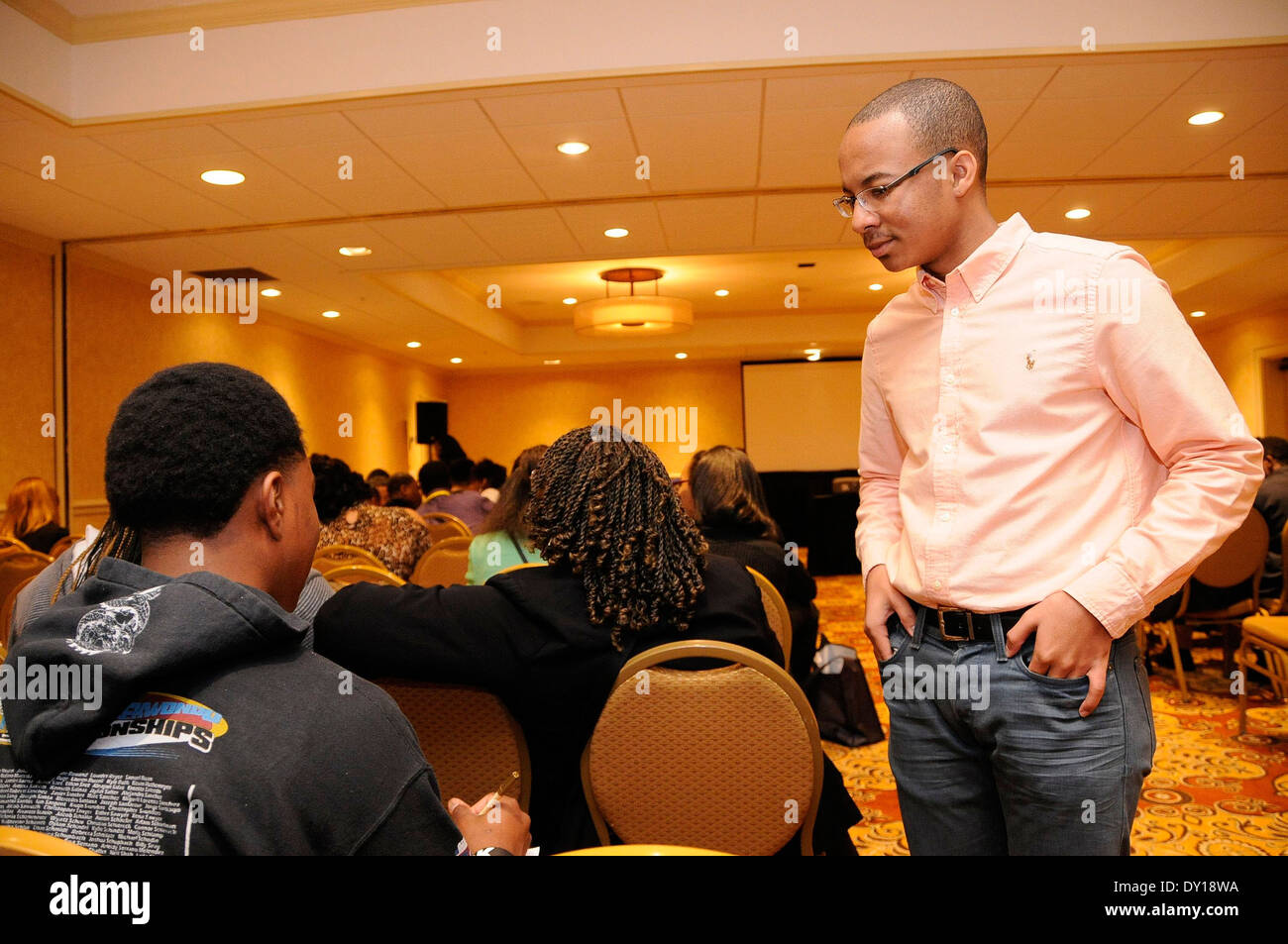 Jaylen Bledsoe, speaks with a conference attendee at the National ...