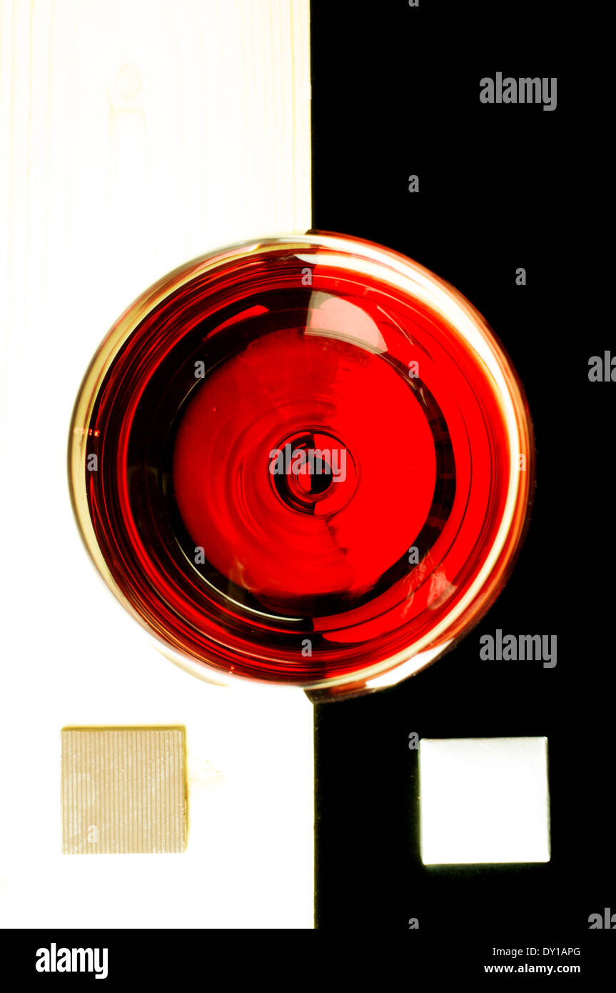 Glass of red wine on a contrasting black-and-white middle. Background ...