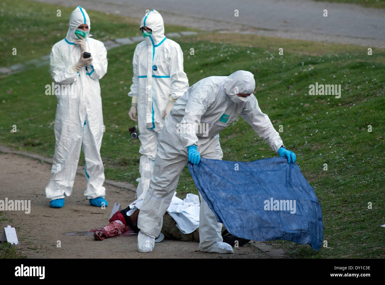 Frankfurt Main, Germany. 02nd Apr, 2014. Forensics examine the dead ...