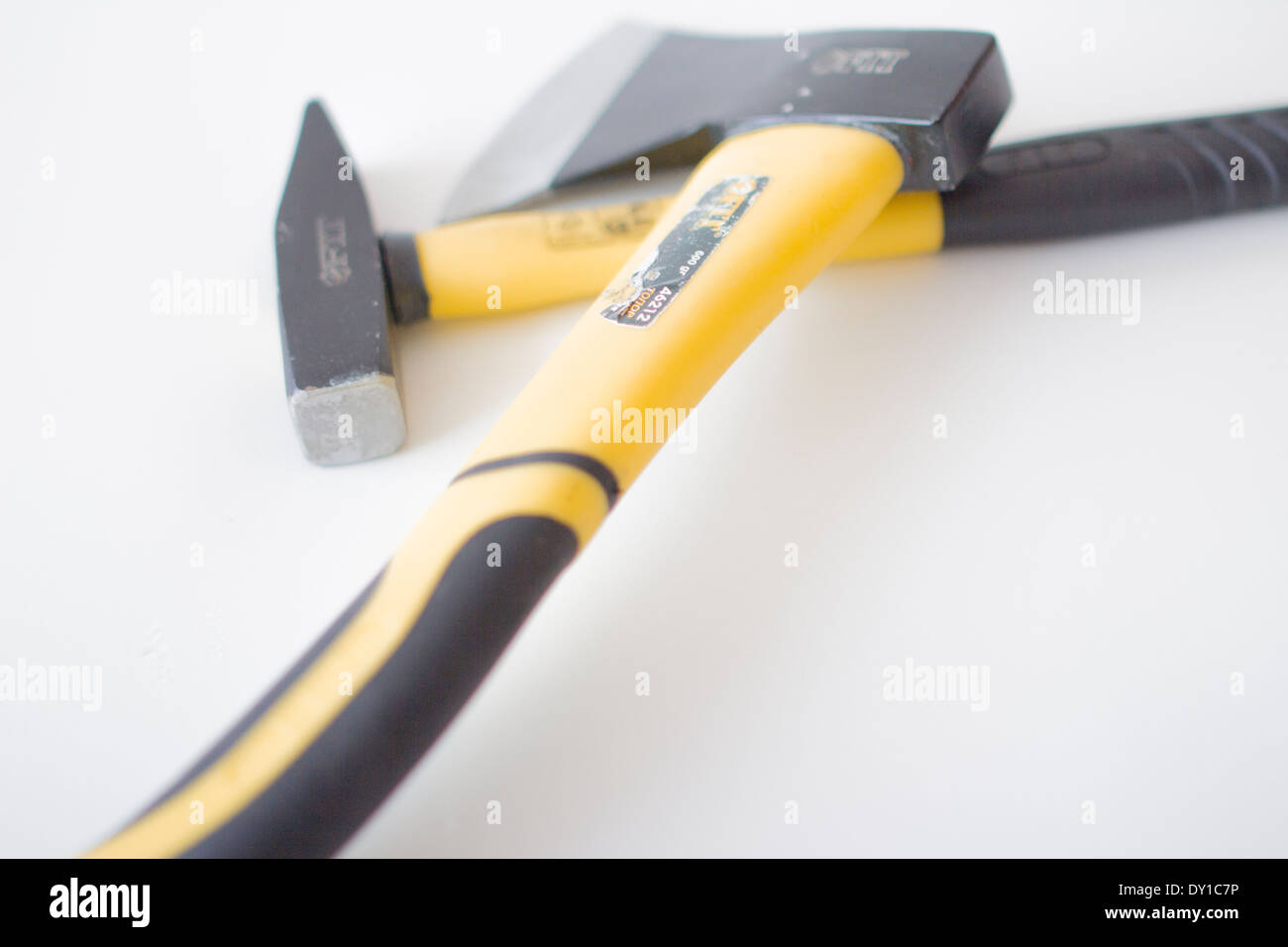 Ax and hammer on white background picture Stock Photo - Alamy