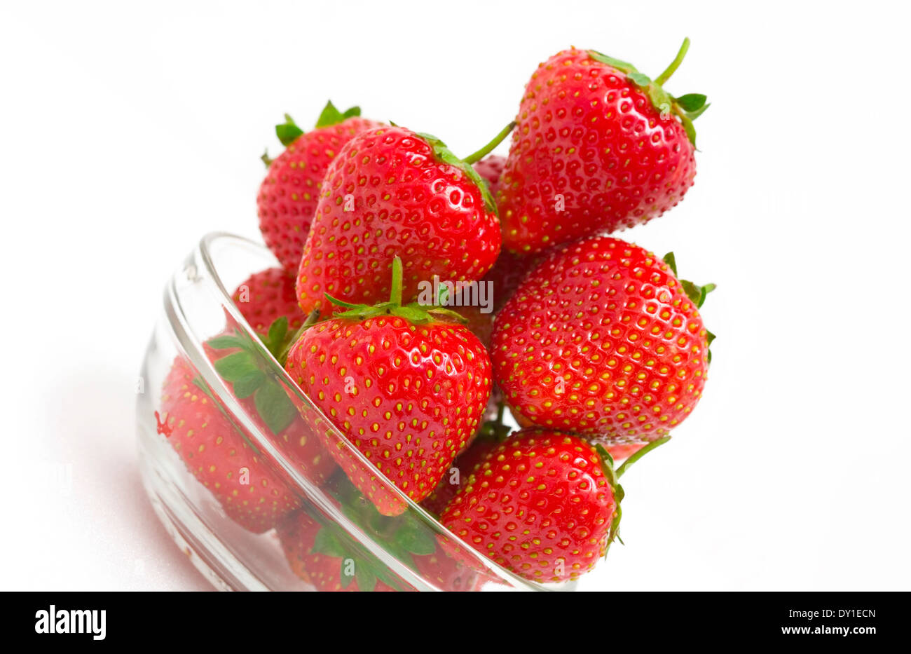 High key photo of fruit dish filled with nice red strawberries Stock ...