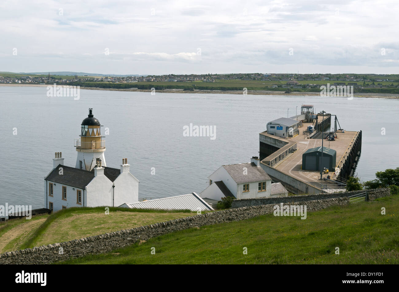 The lighthouse and harbour wall at Scrabster, Caithness, Scotland, UK ...