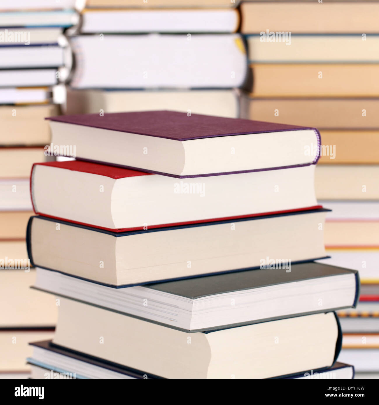 Books in a stack, with more books forming a background Stock Photo - Alamy