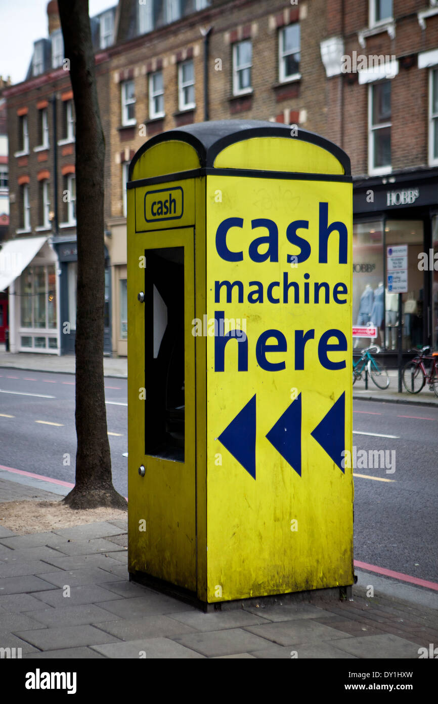a stand-alone yellow cash machine on a pavement Stock Photo - Alamy