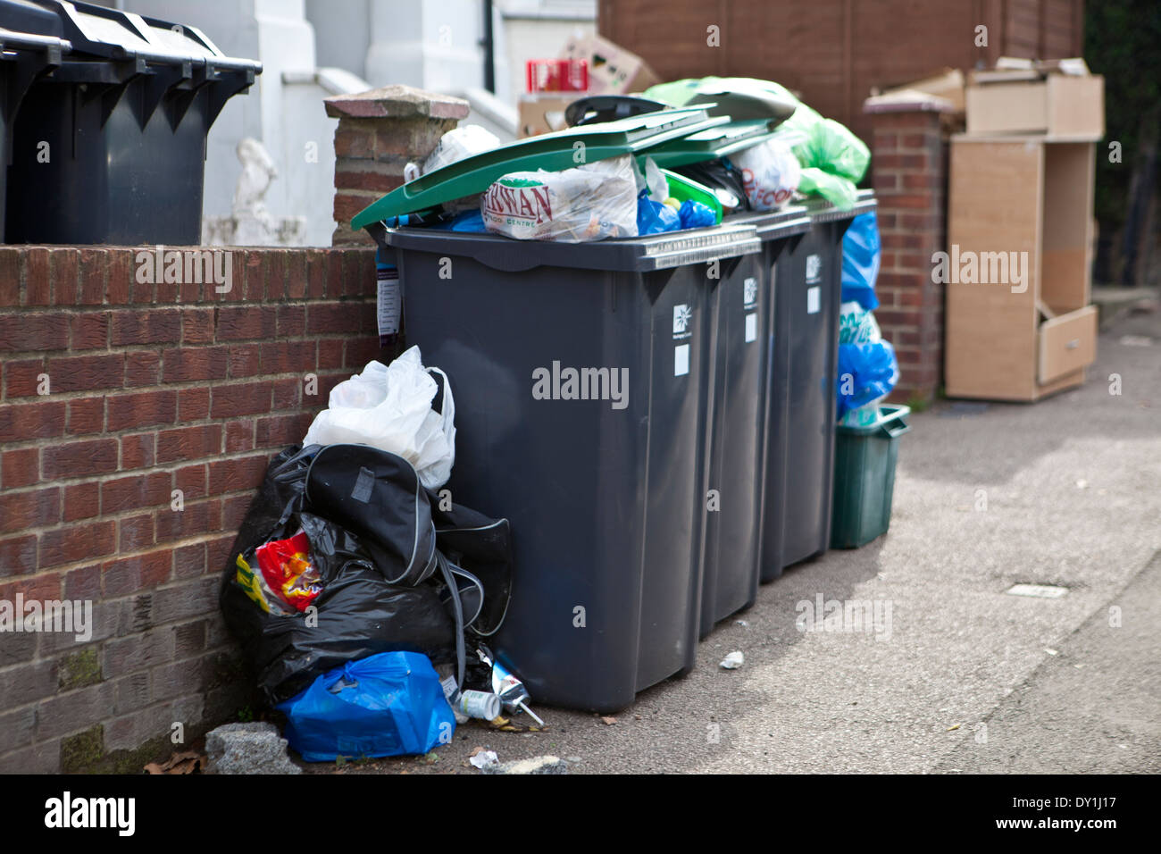 Overflowing wheelie bin hi-res stock photography and images - Alamy