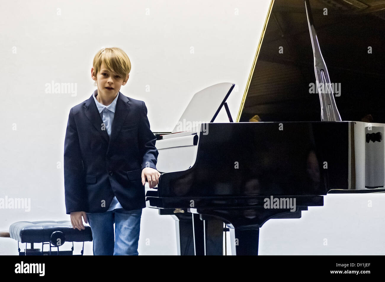 Boy playing piano on stage hi-res stock photography and images - Alamy