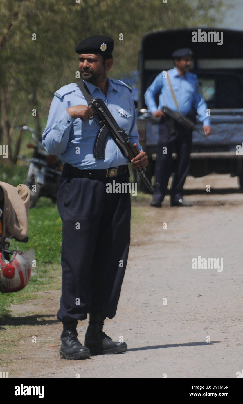 Islamabad, Pakistan. 3rd April 2014. A Pakistan police officer stands ...