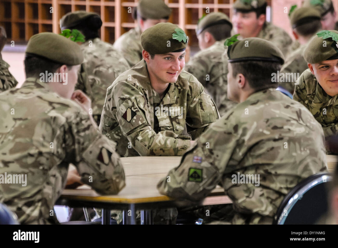 Soldiers from the 2nd Batt. Mercian Regiment sit around tables in a ...