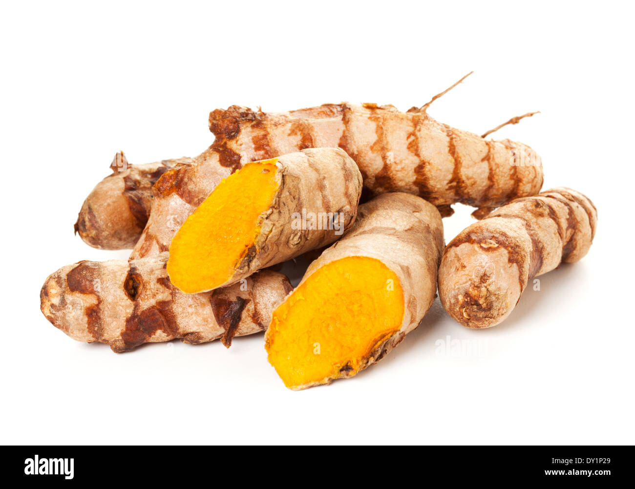Turmeric roots on white background Stock Photo - Alamy