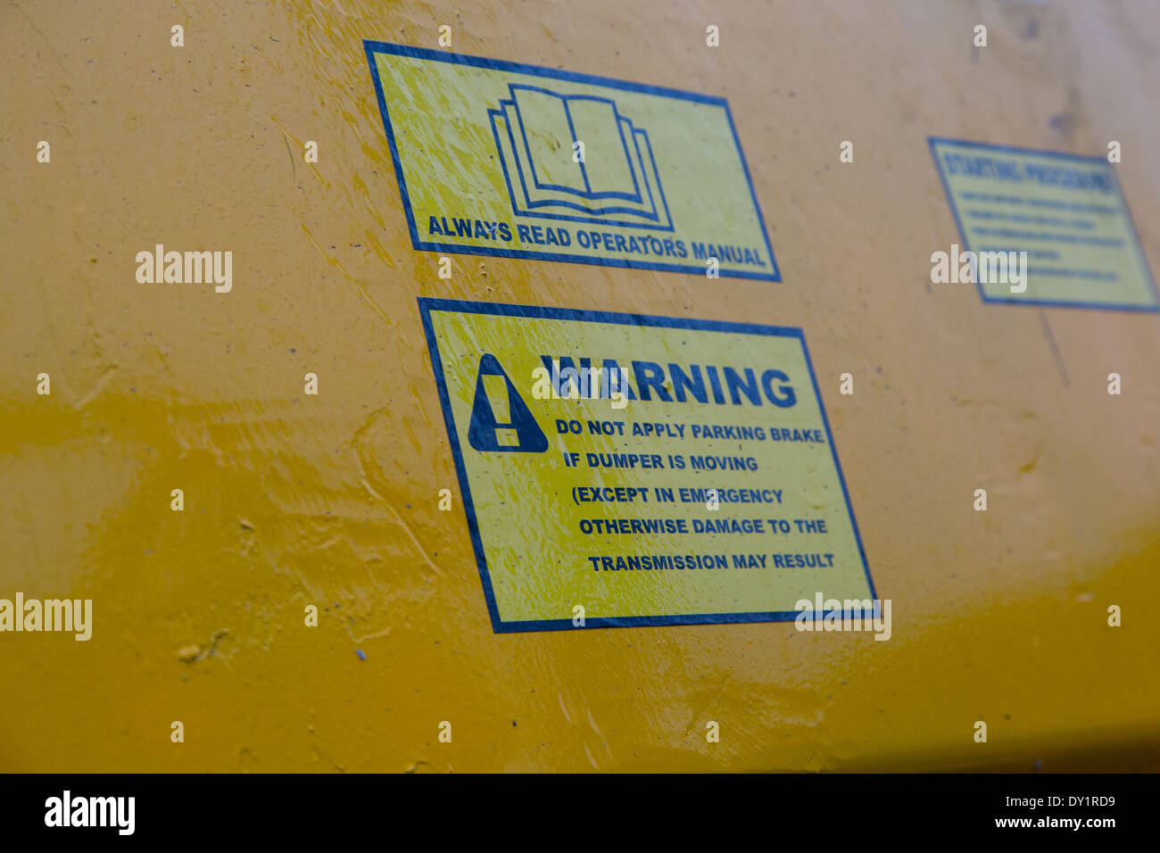 warning signs on construction site equipment Stock Photo - Alamy
