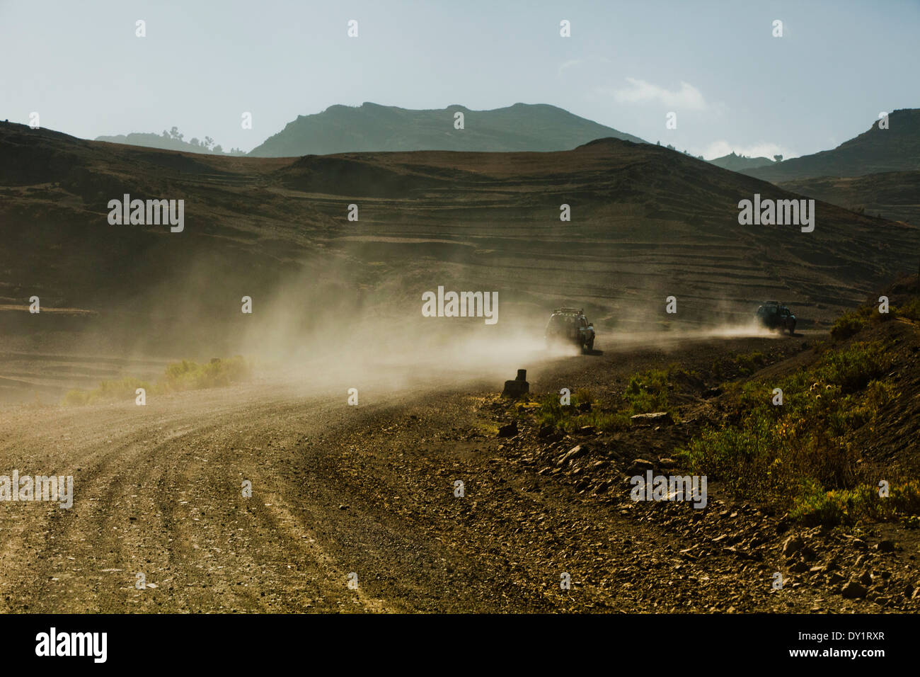 African mountain dusty road with Two Expedition 4WDs Stock Photo - Alamy