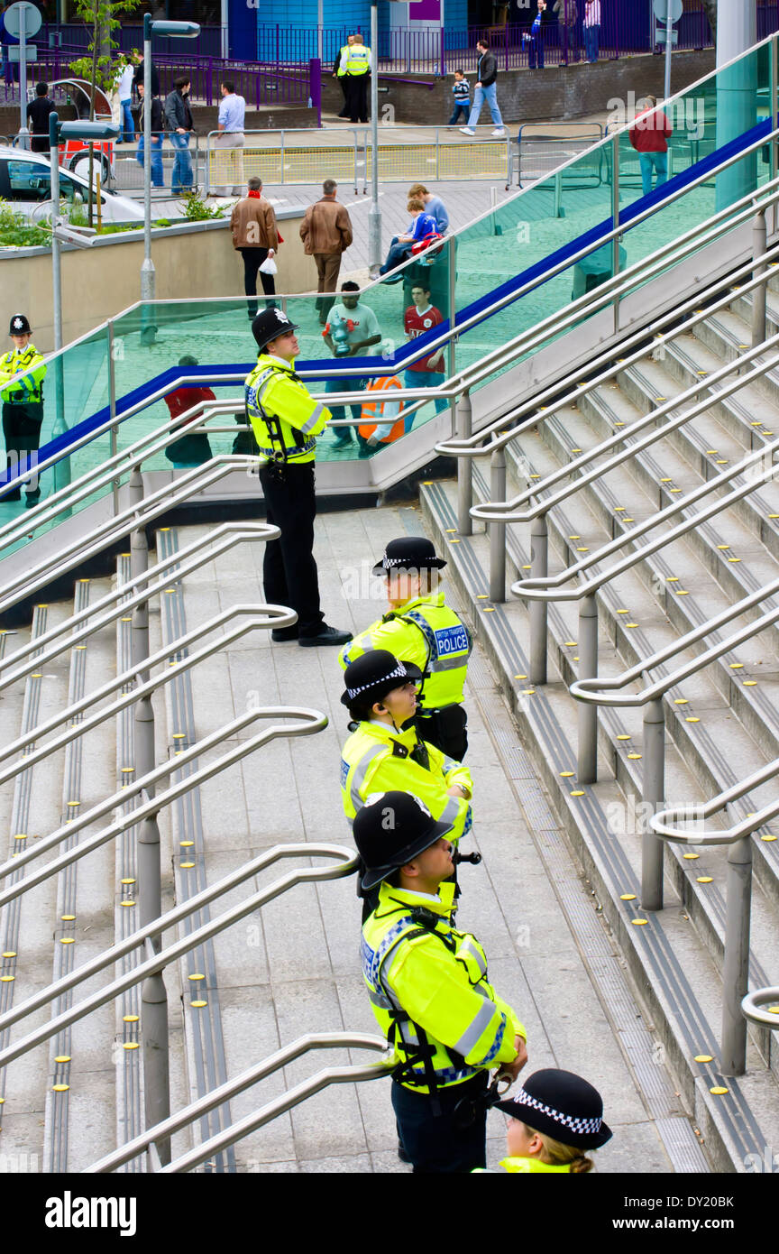British Police Standing Outside Tube Station Stock Photo - Alamy