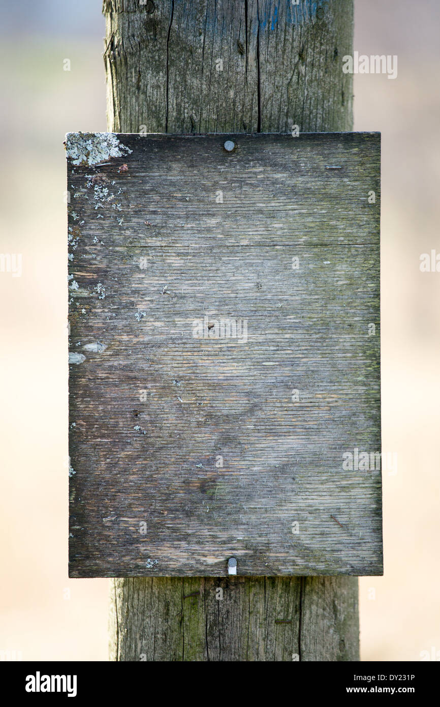 Picture of a old wooden sign nailed to a pole Stock Photo - Alamy