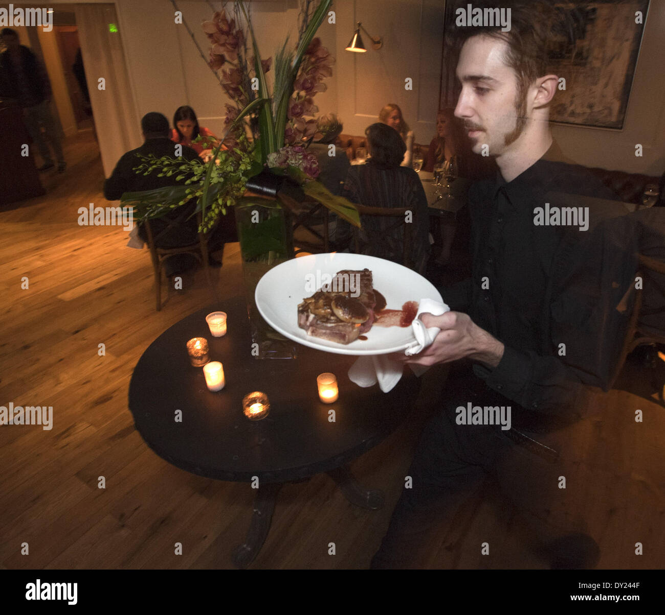 Laguna Beach, California, USA. 27th Nov, 2013. Food runner Devin Kent ...